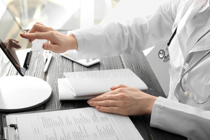 Female Doctor Using Computer at Workplace. Health Care Concept Stock ...