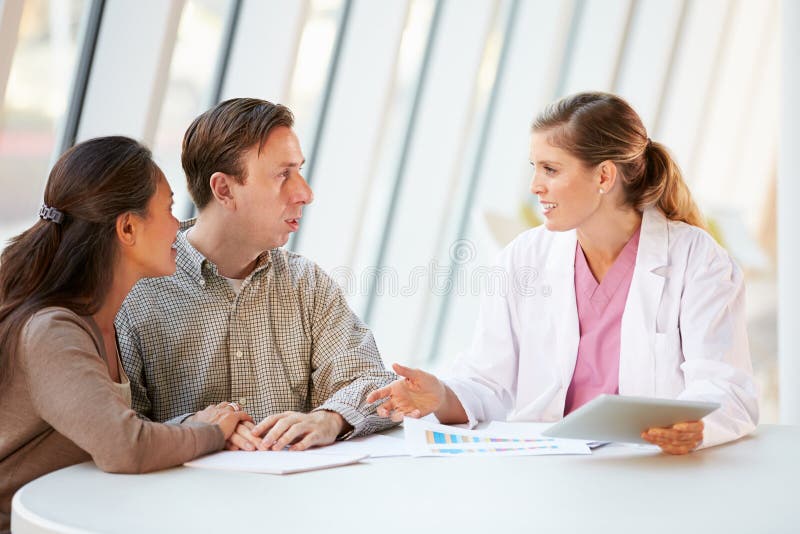 Doctor with Digital Tablet Talking To Patient in Hospital Stock Photo ...