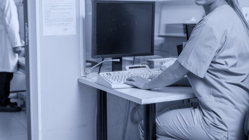 Female Doctor Using Her Computer To Assist Medical Scan Stock Photo ...