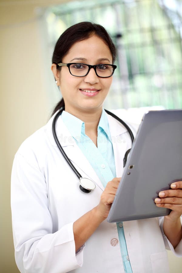 Female Doctor Using Tablet Computer Stock Photo - Image of medication ... Female Doctor Using Tablet Computer Stock Photo - Image of medication ...