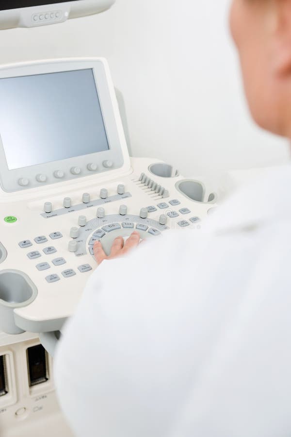 Female Doctor Using Ultrasound Machine Stock Photo - Image of clinic ...