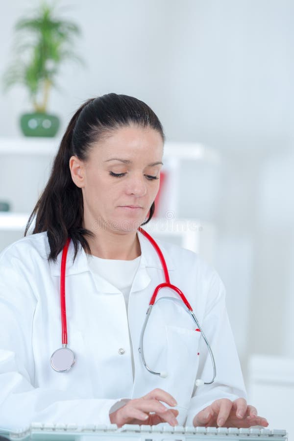 Female Doctor Working at Computer Stock Photo - Image of caucasian ...
