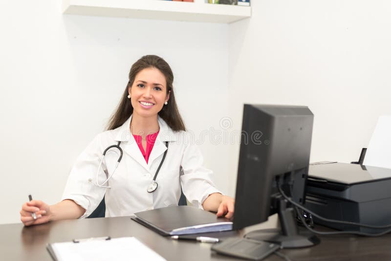 Female Doctor Working on Computer Stock Photo - Image of camera ...