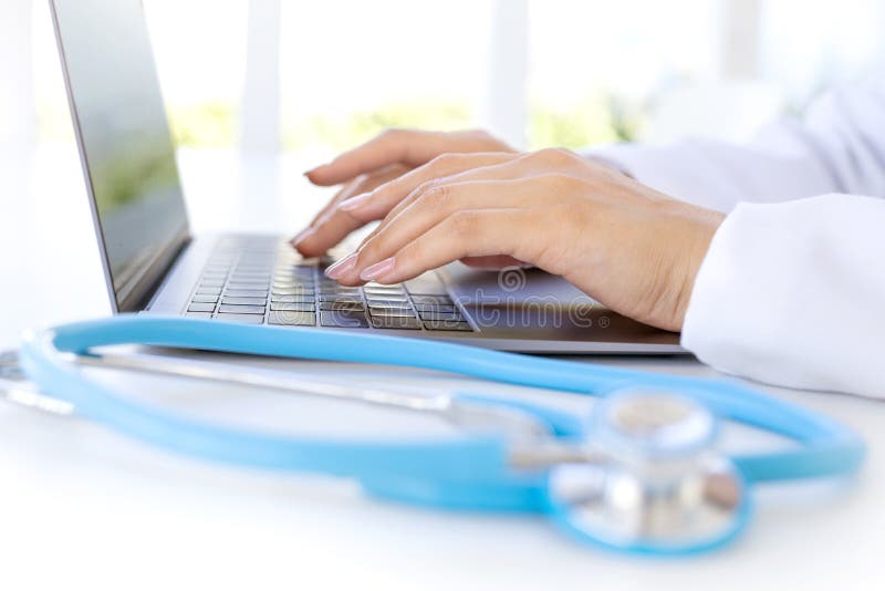 Female Doctor while Working on Computer Stock Photo - Image of online ...