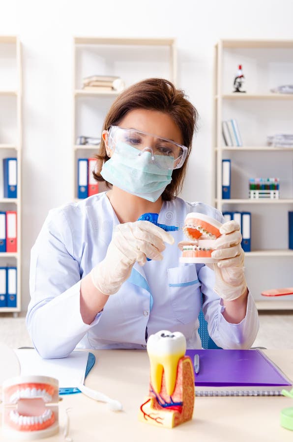 The Female Doctor Working on New Teeth Implant Stock Image - Image of ...