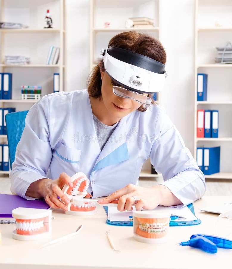 Female Doctor Working on New Teeth Implant Stock Photo - Image of care ...