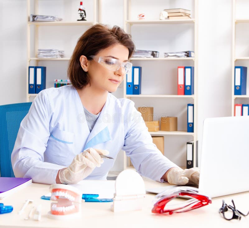 Female Doctor Working on New Teeth Implant Stock Image - Image of ...