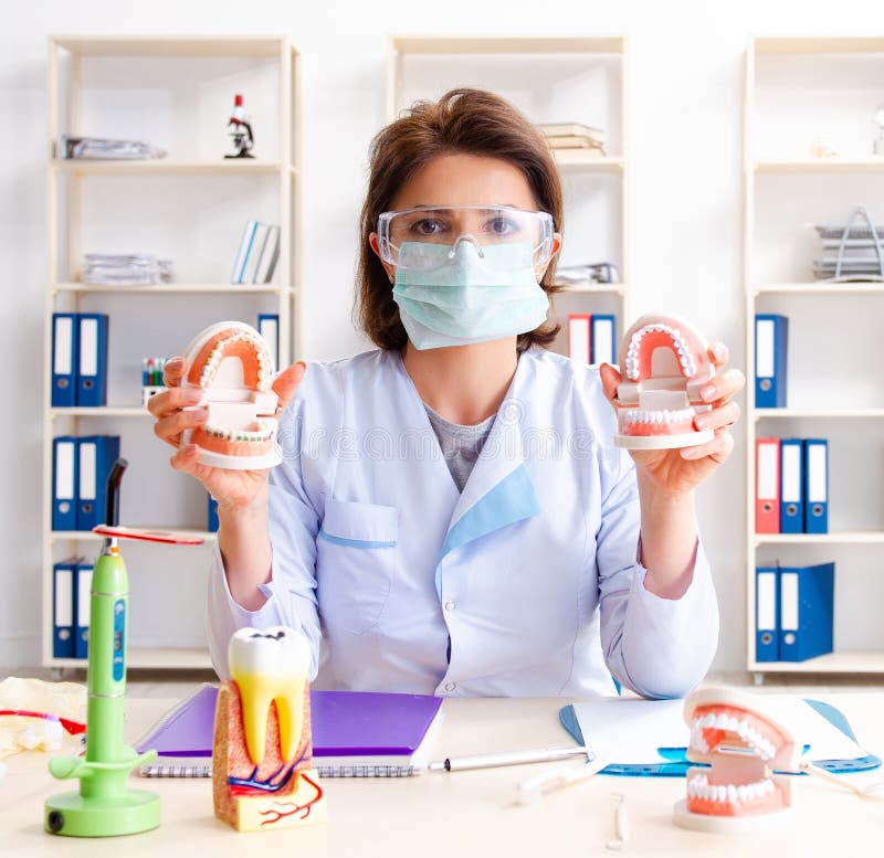 Female Doctor Working on New Teeth Implant Stock Photo - Image of ...