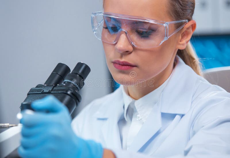 Female Doctor Works in a Modern Scientific Laboratory Using Equipment ...