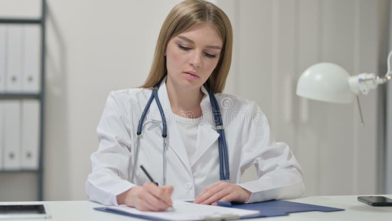 Female Doctor Writing on Paper at Work Stock Video - Video of paper ...
