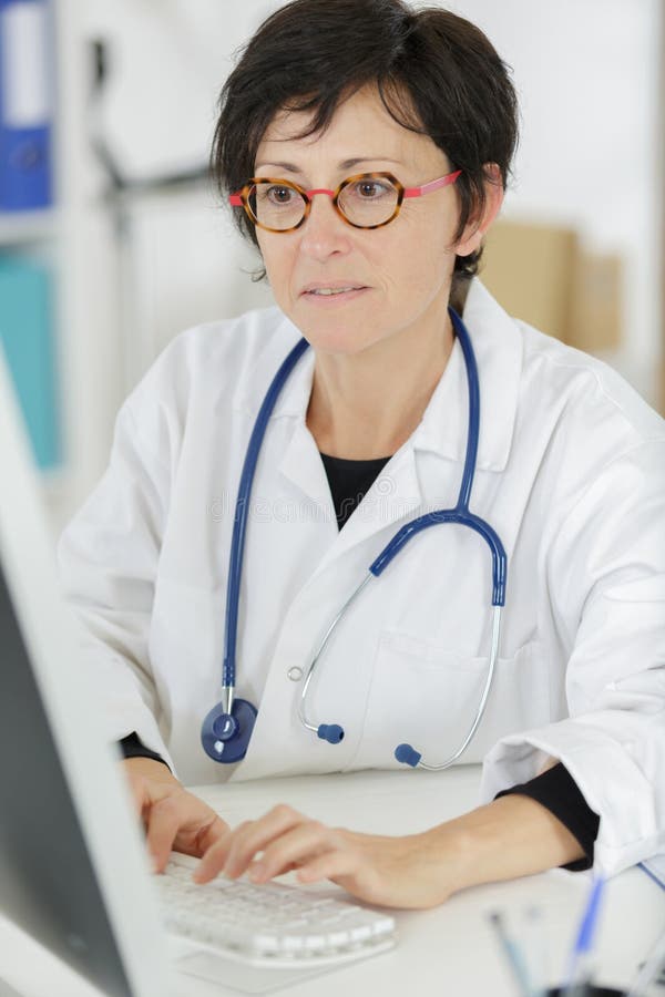 Female Doctors Working Together Stock Photo - Image of posing, adult ...
