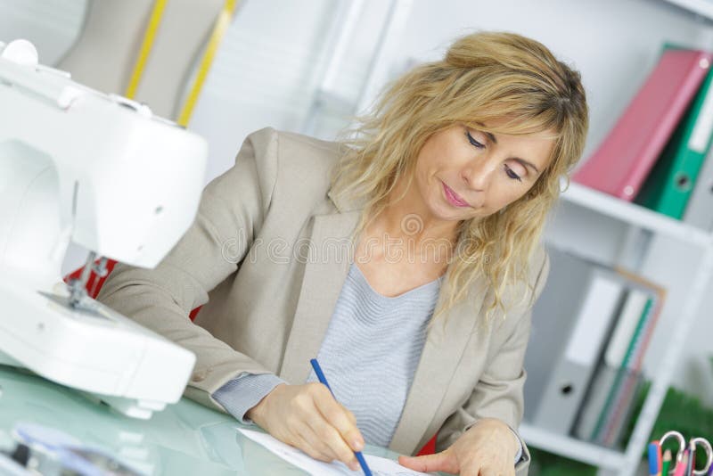 Female Dressmaker in Studio Stock Photo - Image of clothing, indoors ...