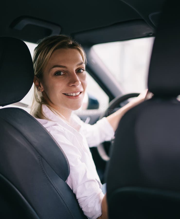 Female Driver in Car Looking at Camera Stock Image - Image of copy ...