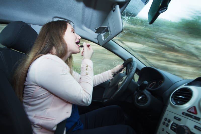 Woman Doing Make-up while Driving Stock Image - Image of woman ...