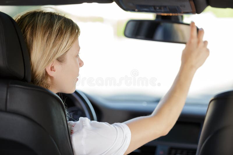 Female Driver Rear View Mirror Stock Photo - Image of automobile ...