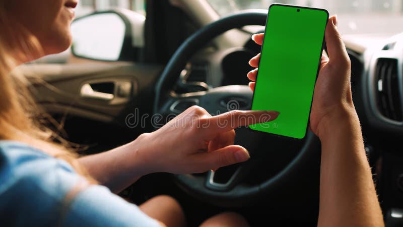 Female Driver Using a Smartphone Inside the Car. Chromakey Smartphone ...