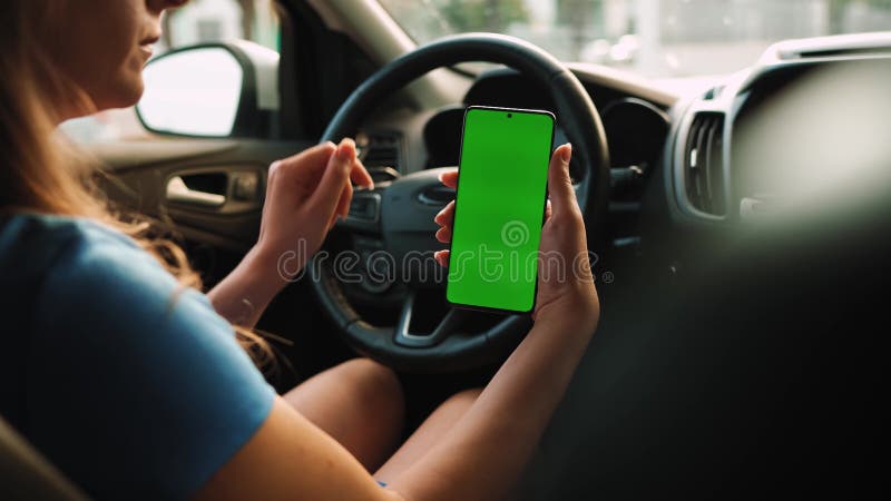 Female Driver Using a Smartphone Inside the Car. Chromakey Smartphone ...