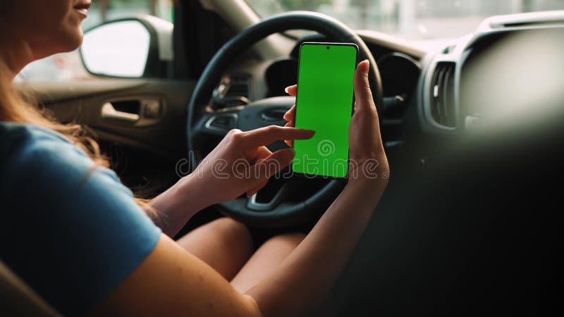 Female Driver Using a Smartphone Inside the Car. Chromakey Smartphone ...