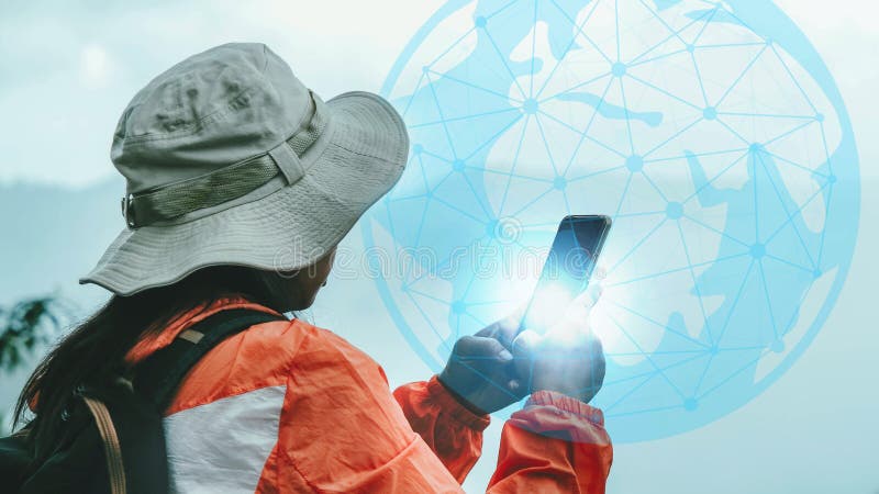 Female Ecologists Carry a Backpack Using a Map on the Phone To Explore ...