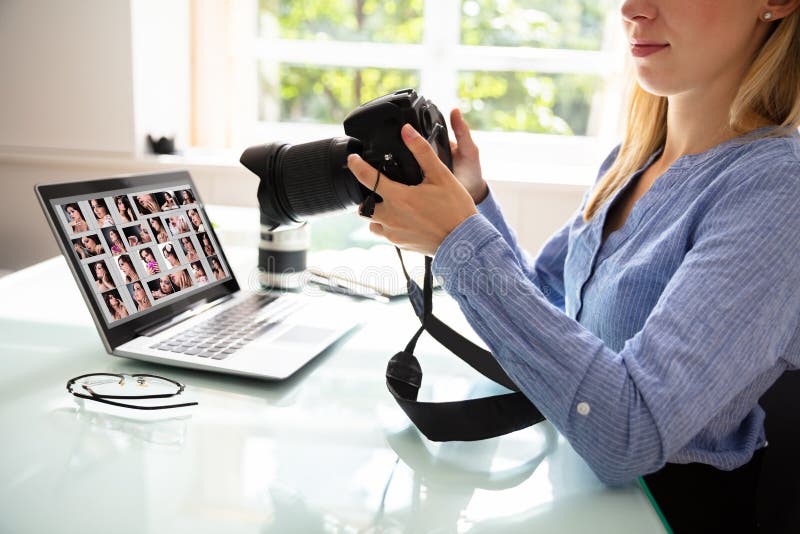 Female Editor Holding DSLR Camera Stock Photo - Image of female ...