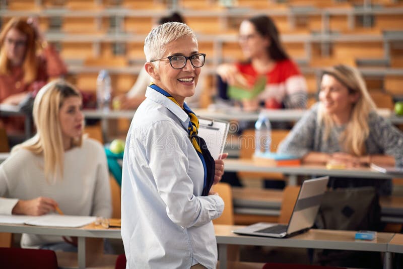 Female Elderly Professor Giving a Lecture Stock Photo - Image of ...