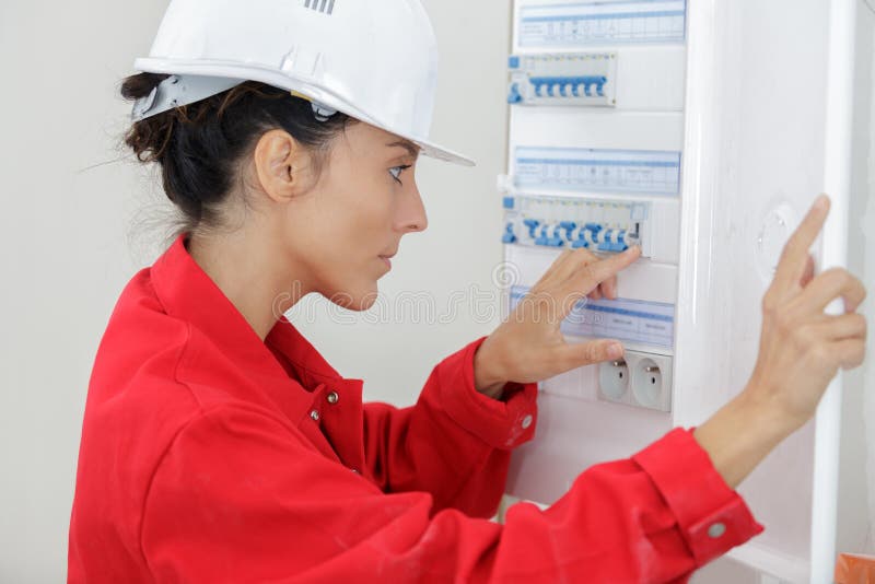 Female Electrician Checking Fuse Box Stock Image - Image of electrician ...