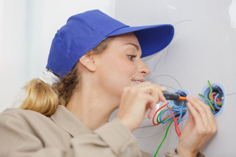 Female Electrician Fixing Electric Cables in Socket Stock Photo - Image ...