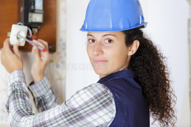 Female Electrician Fixing Electric Cables in Socket Stock Image - Image ...