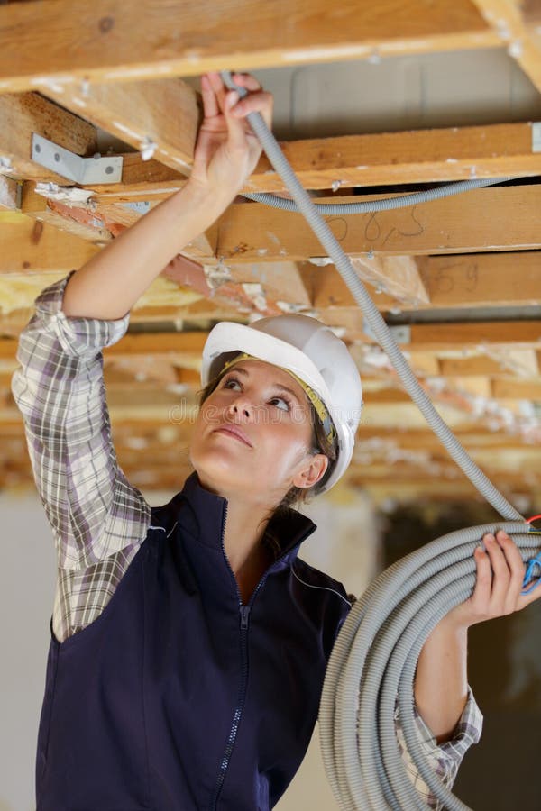 Female Electrician Installing New Wiring Stock Image - Image of ...