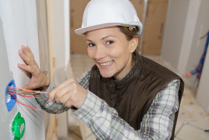 Female Electrician Installing Wall Socket Stock Photo - Image of ...