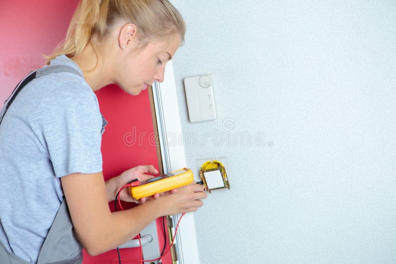 Female Electrician Testing Voltage Stock Image - Image of electrics ...