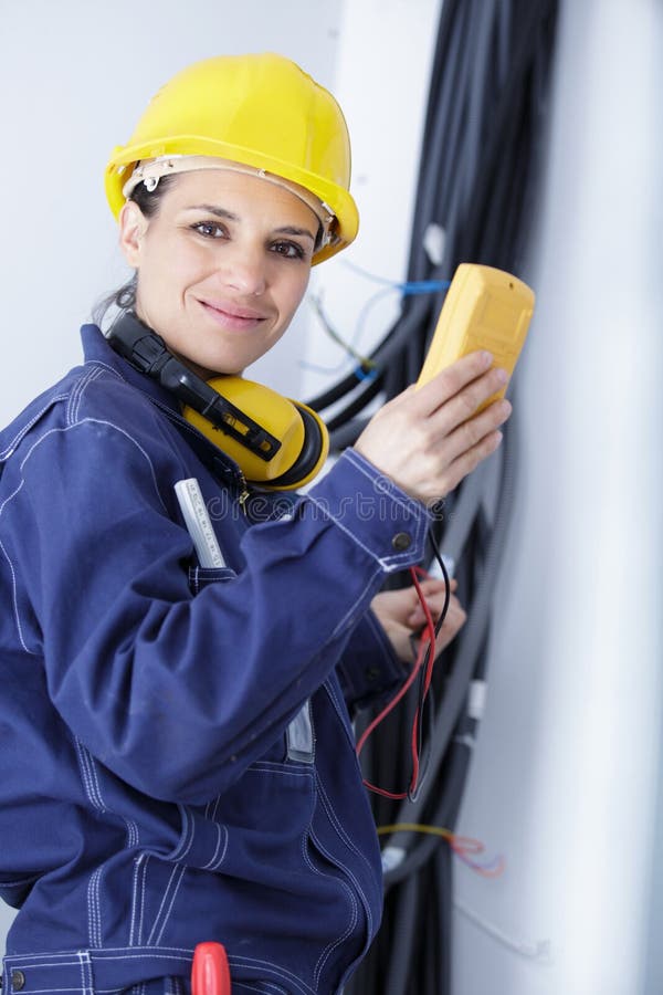 Female Electrician Using Multimeter Stock Image - Image of working ...