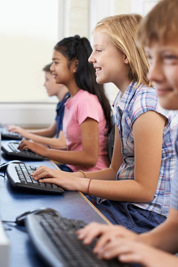 Female Elementary Pupil in Computer Class Stock Image - Image of ...