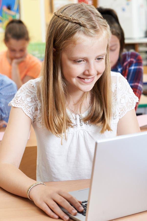 Female Elementary School Pupil Using Laptop in Computer Class Stock ...