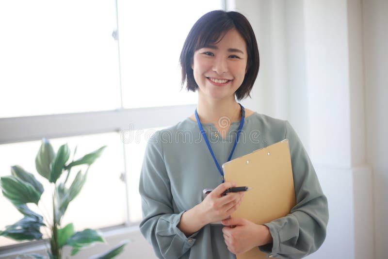 Female Employee with a Binder Stock Photo - Image of dress, hair: 238934650