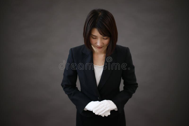 Female employee bowing stock photo. Image of courtesy - 242459984