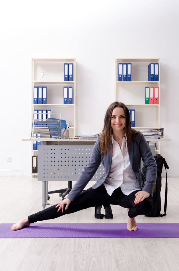 The Female Employee Doing Sport Exercises in the Office Stock Photo ...