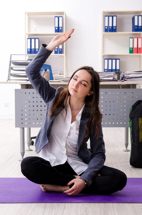 The Female Employee Doing Sport Exercises in the Office Stock Photo ...