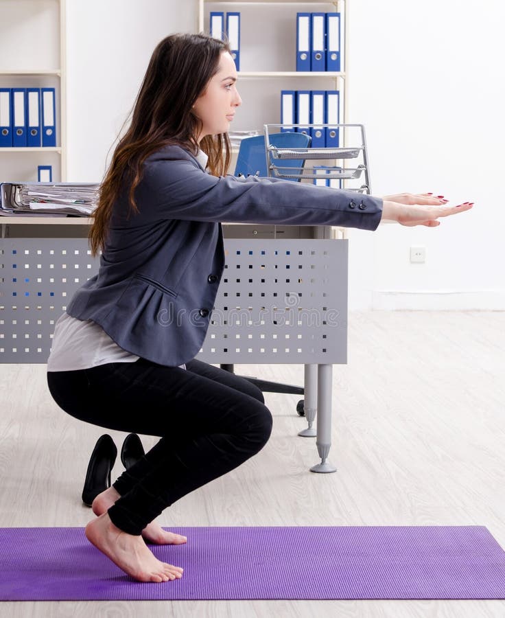 Female Employee Doing Sport Exercises in the Office Stock Photo - Image ...