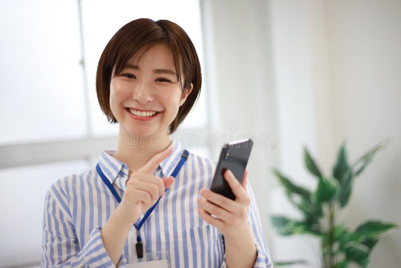Female Employee Operating a Smartphone Stock Image - Image of hunting ...