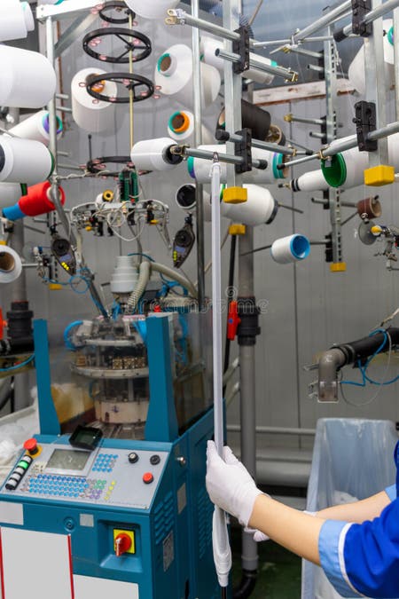 A Female Employee Performs Visual Quality Control of Hosiery Stock ...