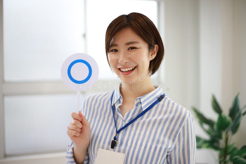 Female Employee with a Round Bill and a Binder Stock Photo - Image of ...