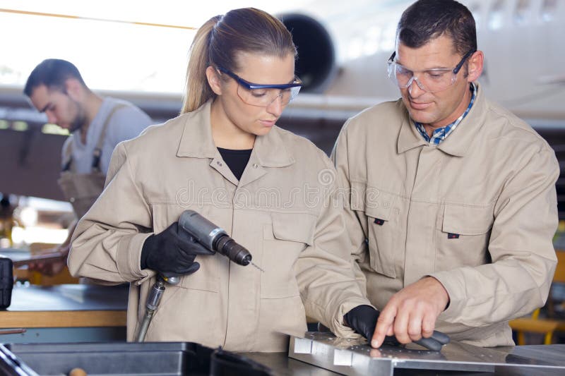 Female Employee Training To Use Drill Stock Photo - Image of machinist ...