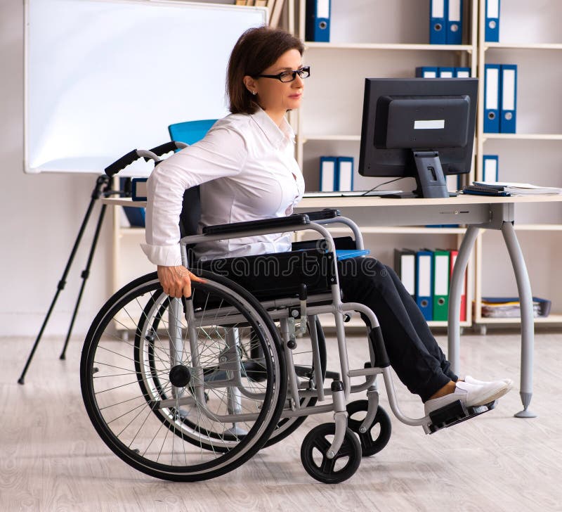 Female Employee in Wheel-chair at the Office Stock Photo - Image of ...