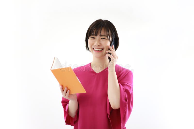 A Female Employee Who Makes a Call with a Notebook Stock Image - Image ...