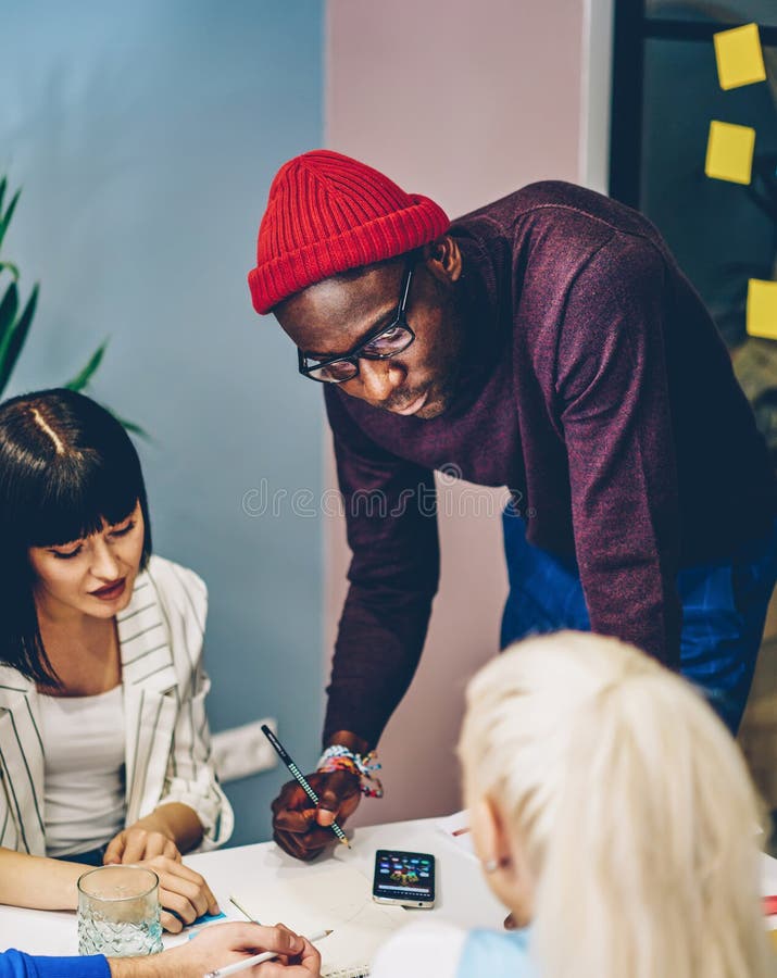 Female Employees Cooperating on Project Talking To Each Other in Office ...