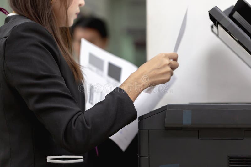 Female Employees Use Black Copy Machines Stock Photo - Image of ...