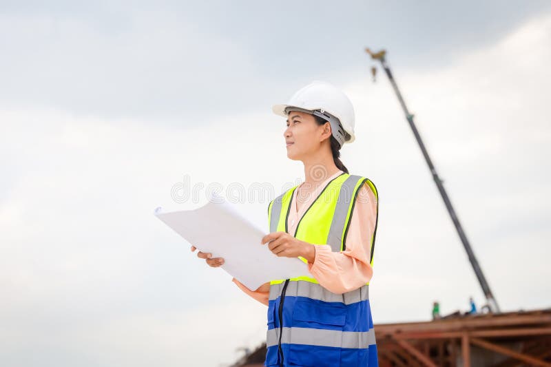 Female Engineer Checking Project at Building Infrastructure Site ...