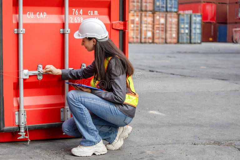 Female Engineer with Clipboard Inspecting Cargo Containers, Foreman ...