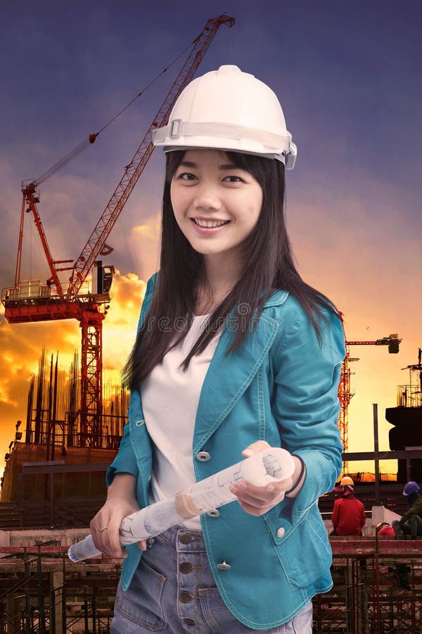Female Engineer with Construction Plant Against Building Stucture Site ...